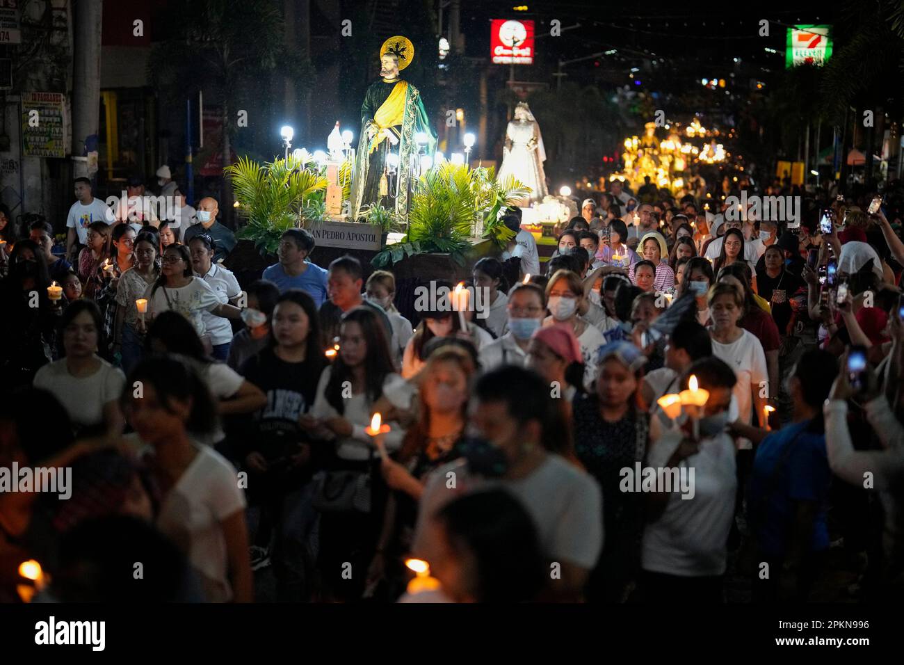 Devotees join a procession of religious statues during Easter Sunday ...