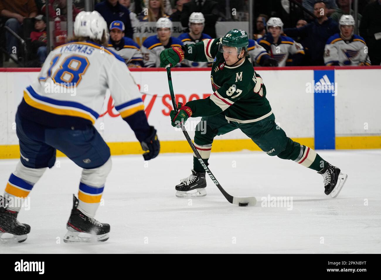Minnesota Wild left wing Kirill Kaprizov skates with the puck next to ...