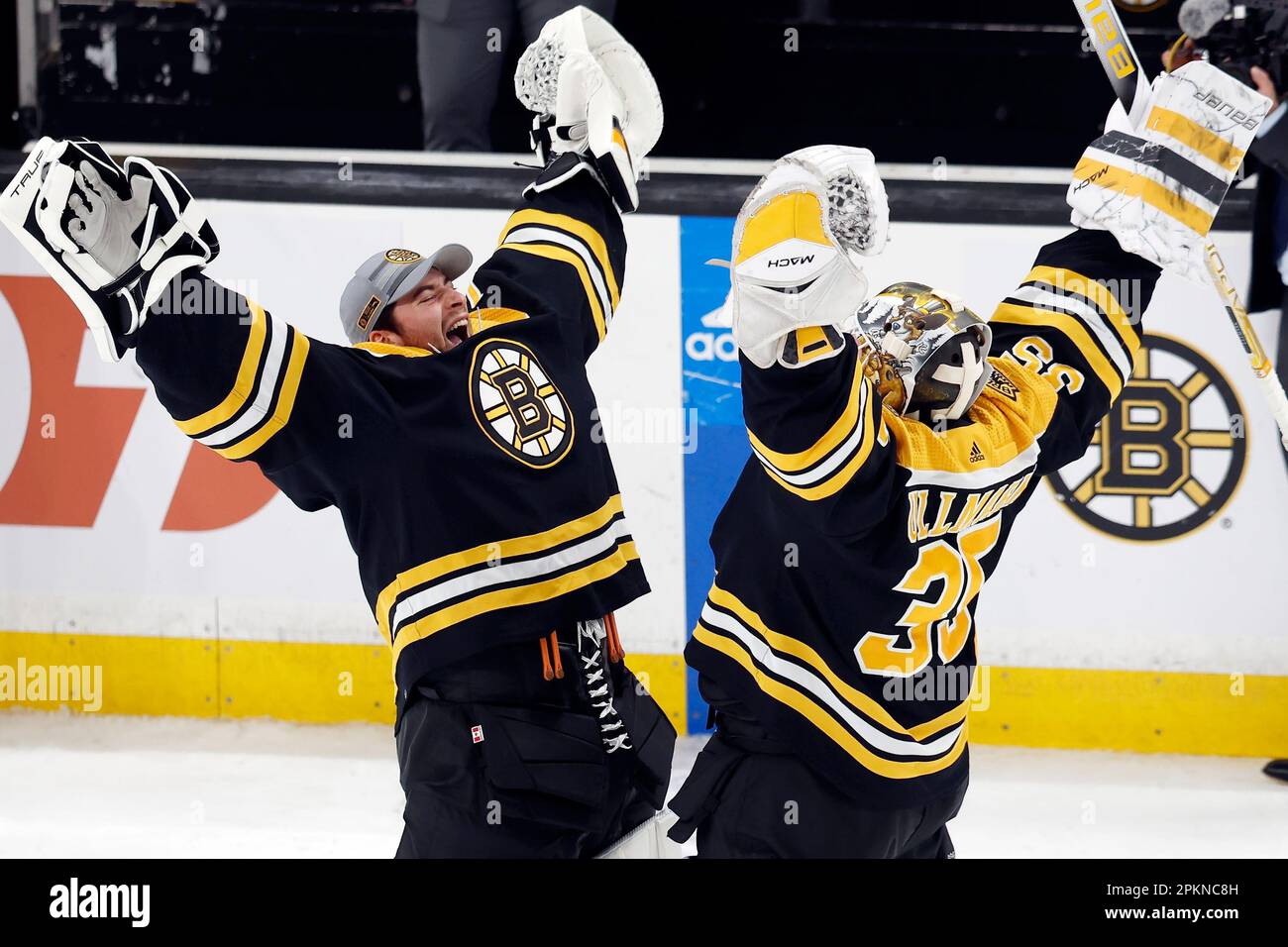 Boston Bruins' Linus Ullmark (35) and Jeremy Swayman celebrate the team ...