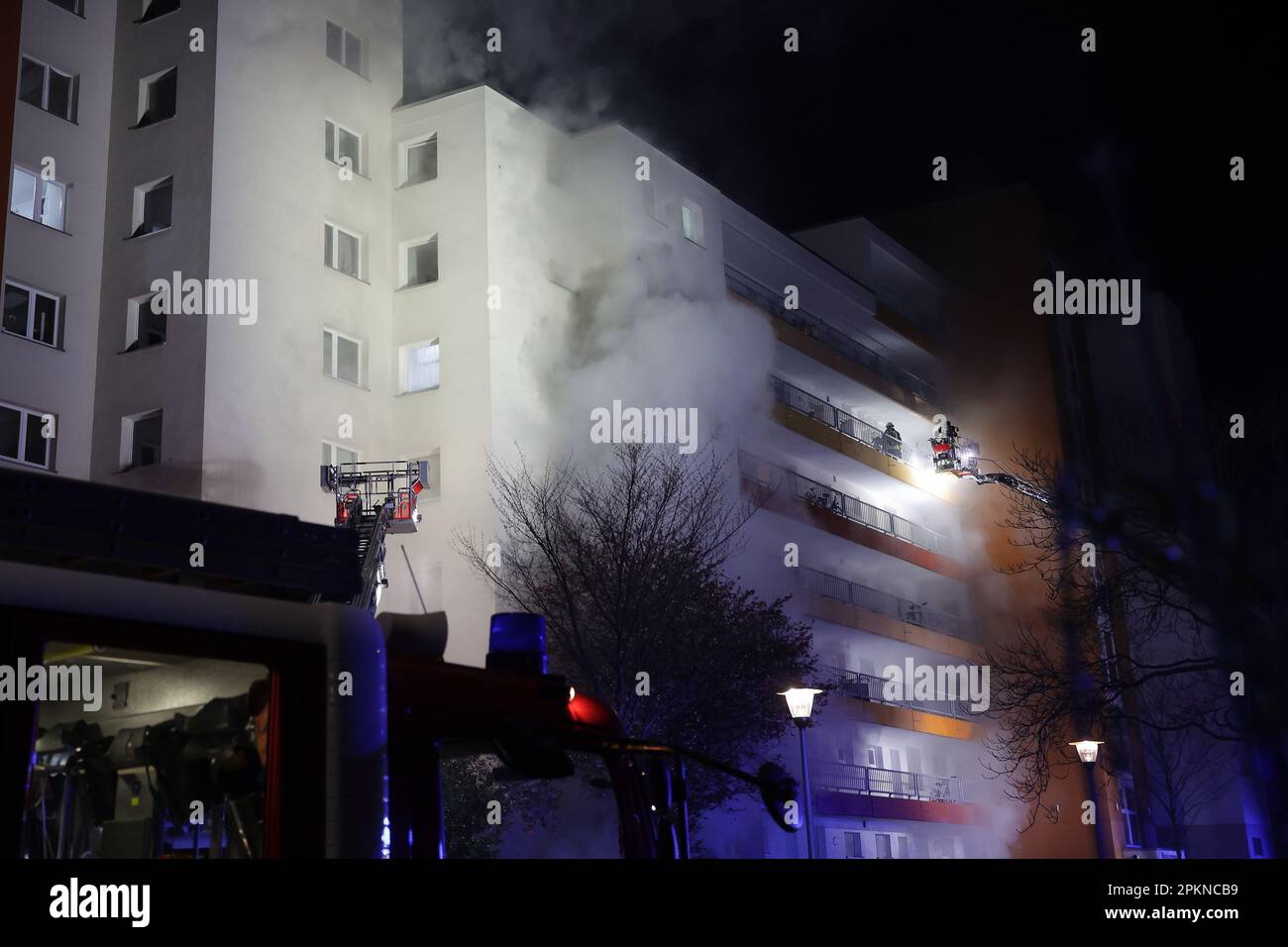 Bonn, Germany. 09th Apr, 2023. Firefighters work on a burning high-rise ...