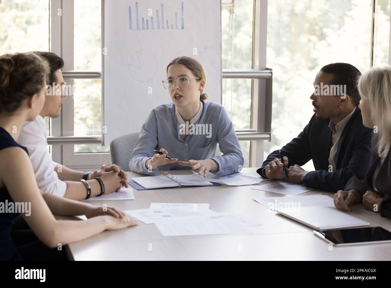 Female mentor, corporate teacher, coach training group of intern Stock Photo - Alamy