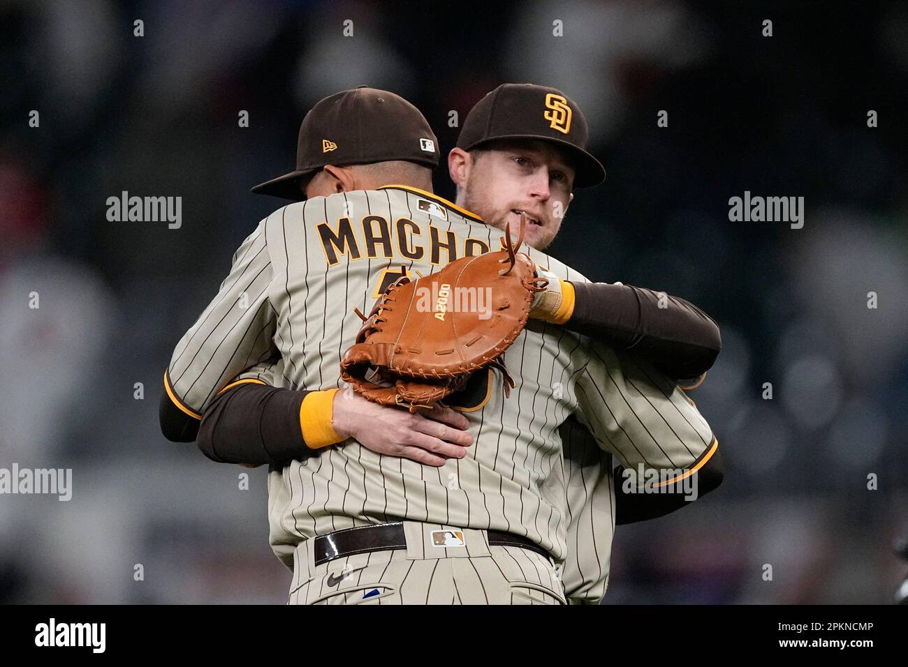 San Diego Padres Manny Machado and Jake Cronenworth, rear, embrace ...