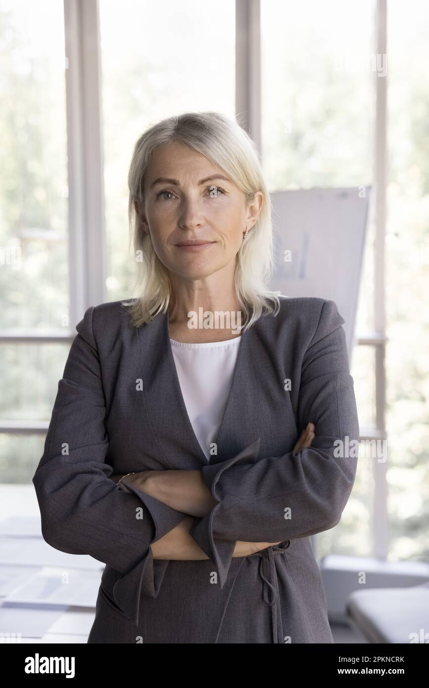 Serious old businesswoman looking camera hi-res stock photography and ...
