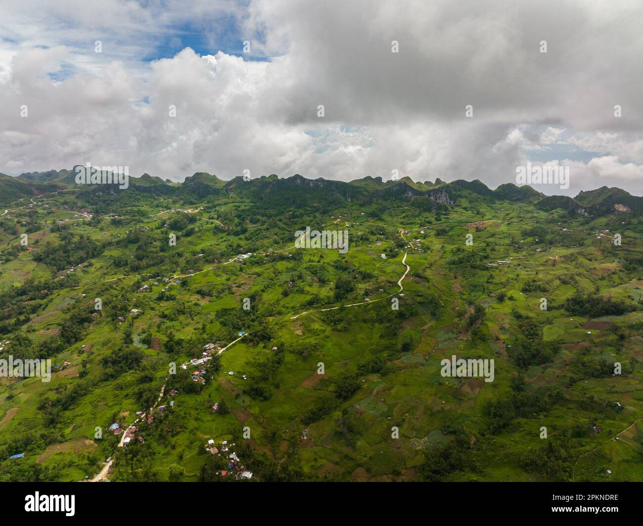 Aerial view of agricultural land among mountains and hills in the ...