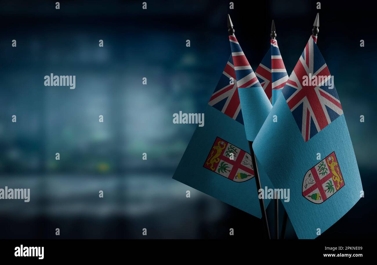 Small flags of the Fiji on an abstract blurry background Stock Photo ...
