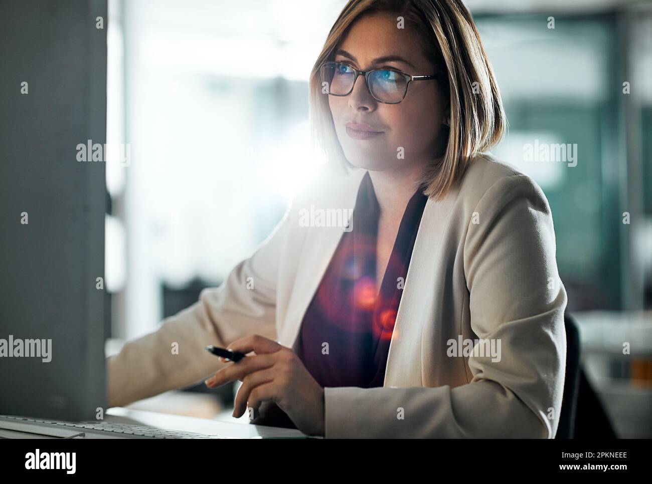 Success requires 100 percent commitment, anything else is irrelevant. a businesswoman sitting at ...