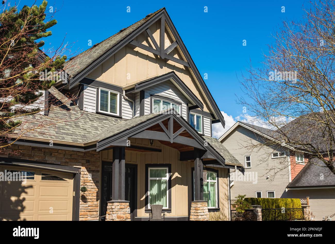 Facade of a house with nice windows in the blue sky background ...