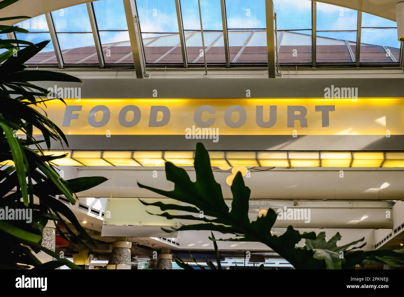 Neon sign read Food Court above the hallway in the shopping mall. Food ...