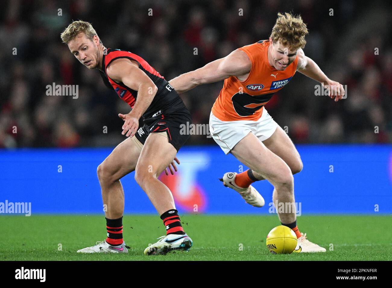 Darcy Parish of Essendon (left) and Tom Green of the Giants in action ...