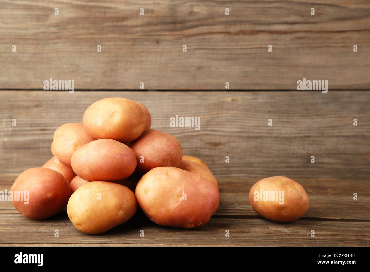 Potatoes on grey background with copy space, top view Stock Photo - Alamy