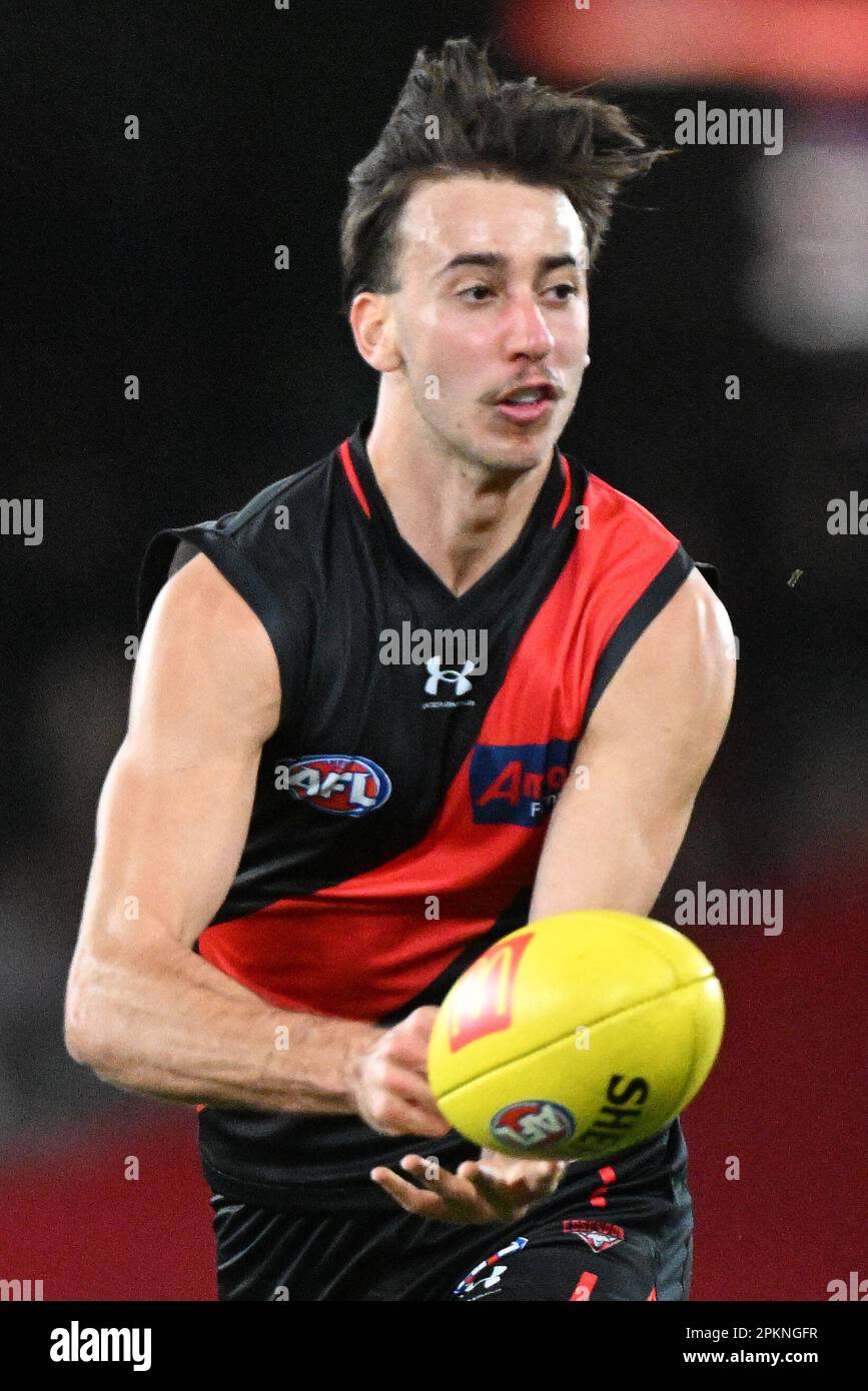 Nic Martin of Essendon handballs the footy during the AFL Round 4 match ...