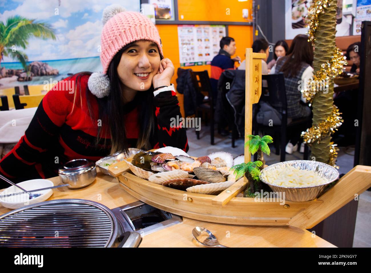 Travelers thai people travel visit eat drink and take photo with food grilled roasted seafood ...