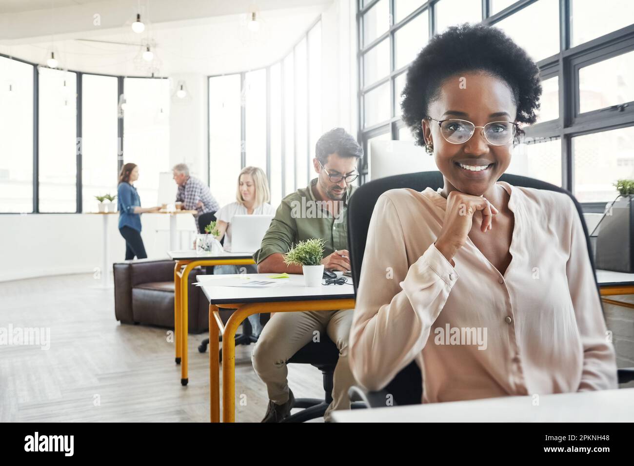 Success is my middle name. a young designer in an office with her ...