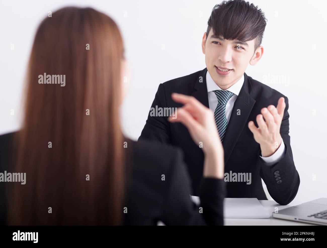 Business manager interviewing young women job applicant in the office ...