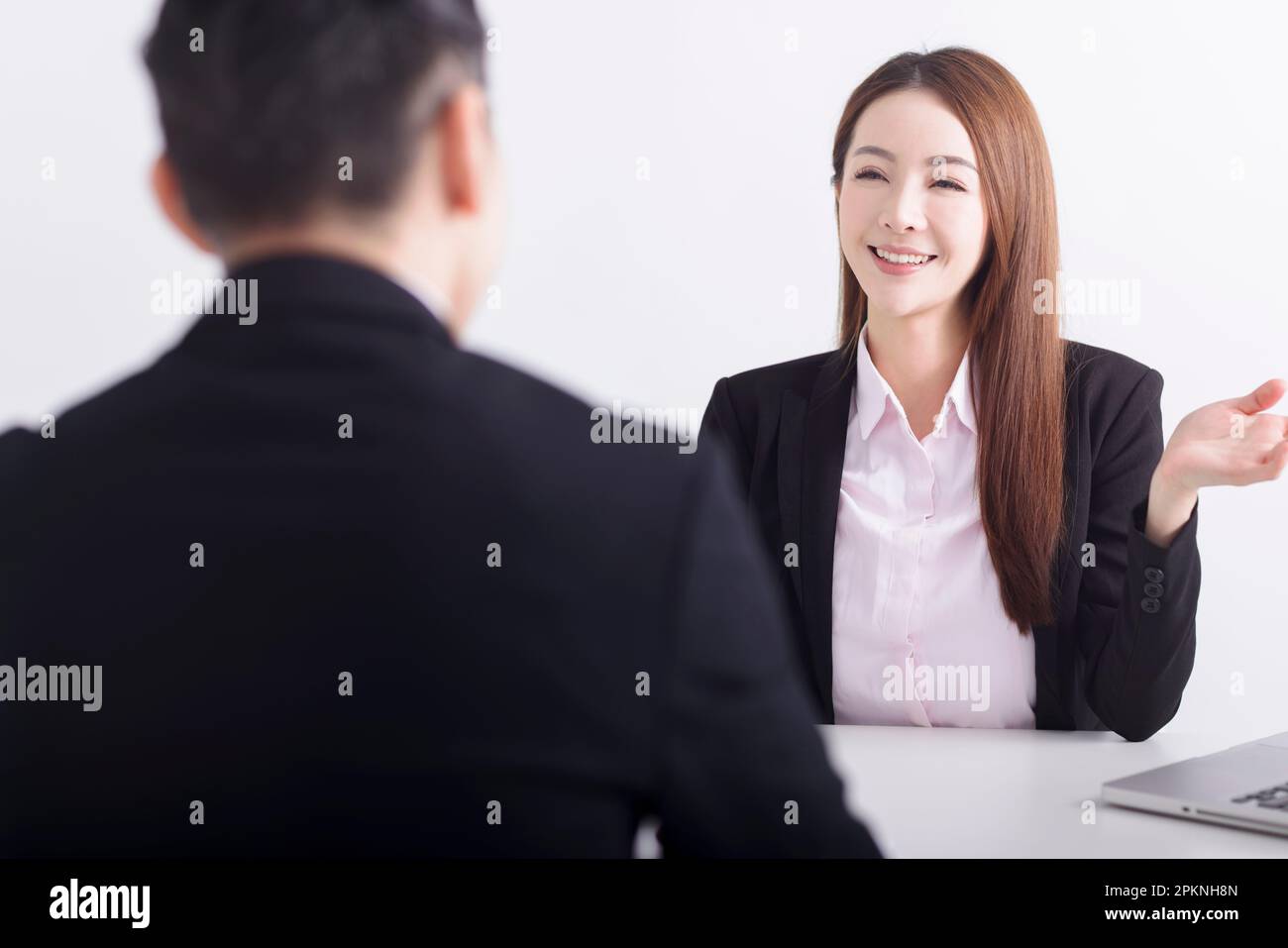 Business manager interviewing young women job applicant in the office ...