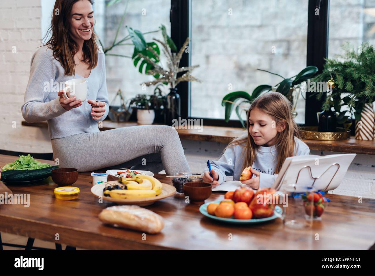 Child studying at dinner table hi-res stock photography and images - Alamy