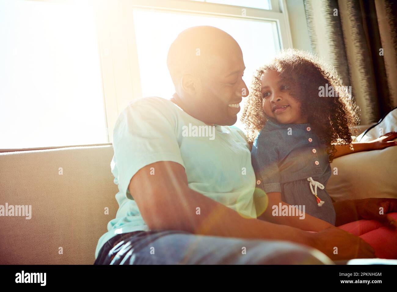 Spending precious father-daughter moments. a happy little girl and her ...