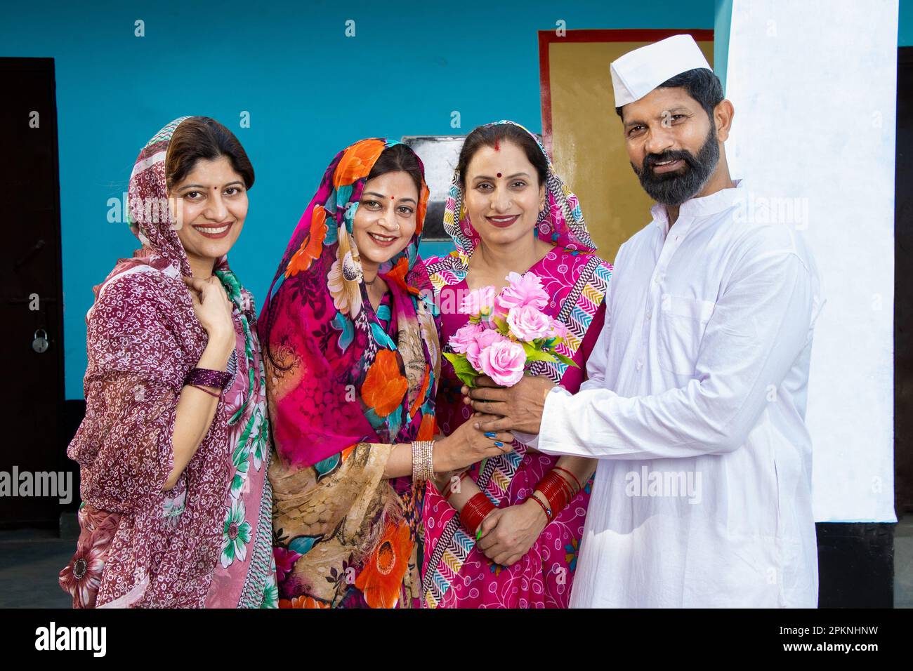 Indian man politician receive bouquet of flower by group of traditional ...