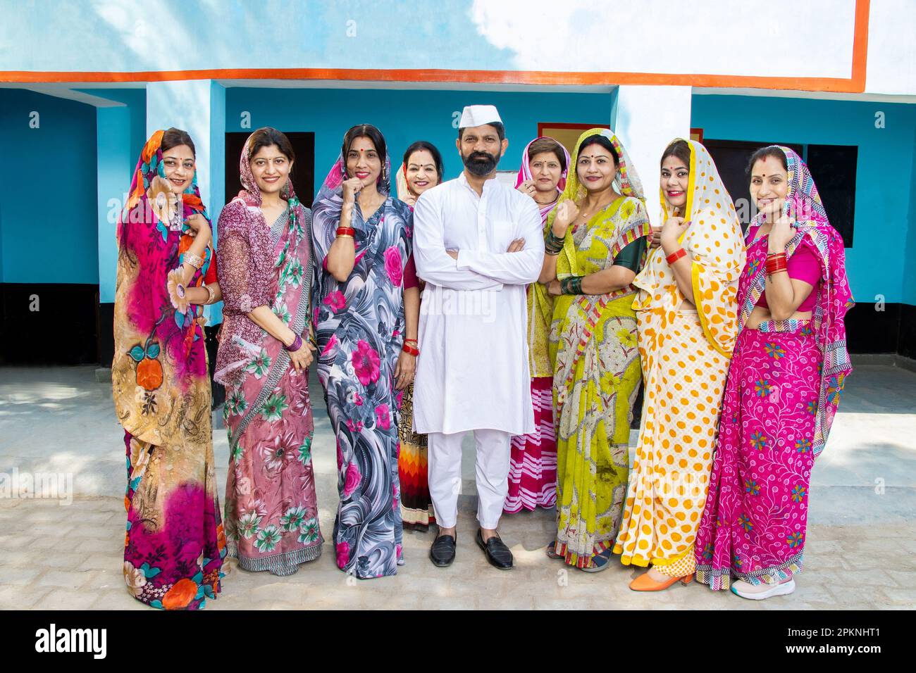 Indian man politician standing along with group of traditional women ...