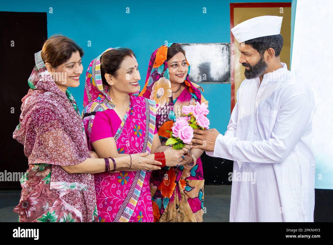 Indian man politician receive bouquet of flower by group of traditional ...