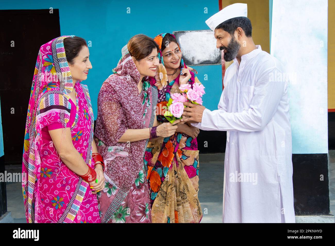 Indian man politician receive bouquet of flower by group of traditional ...