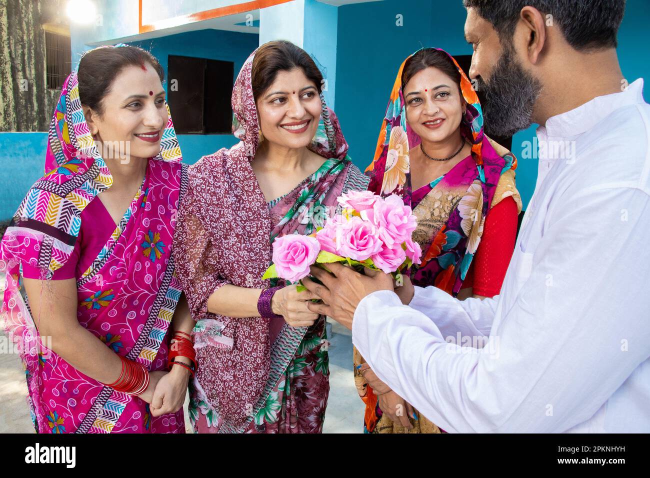 Indian man politician receive bouquet of flower by group of traditional ...