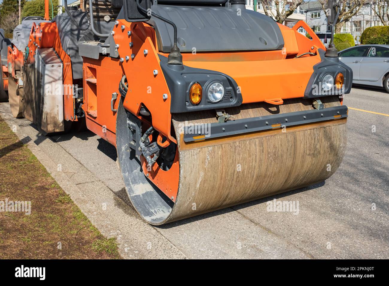 Close view on the road roller working on the new road construction site ...