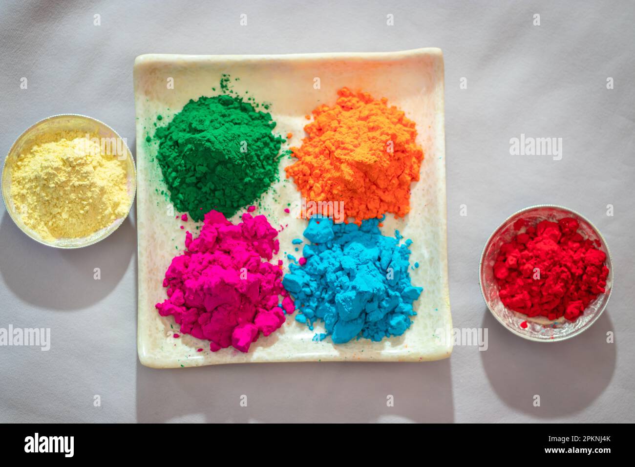 holi celebration plat decorated with colors from flat angle Stock Photo ...