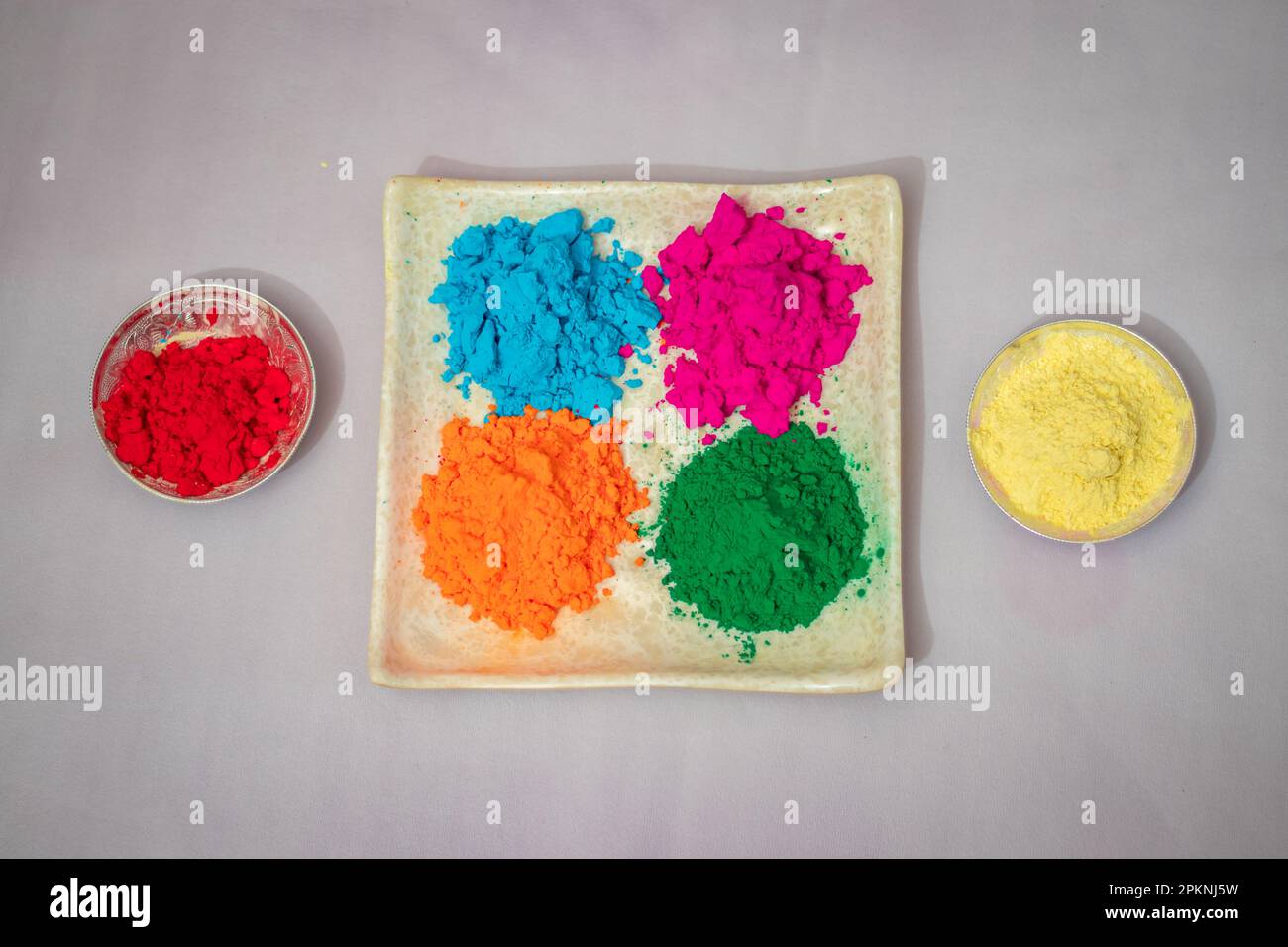 holi celebration plat decorated with colors from flat angle Stock Photo ...