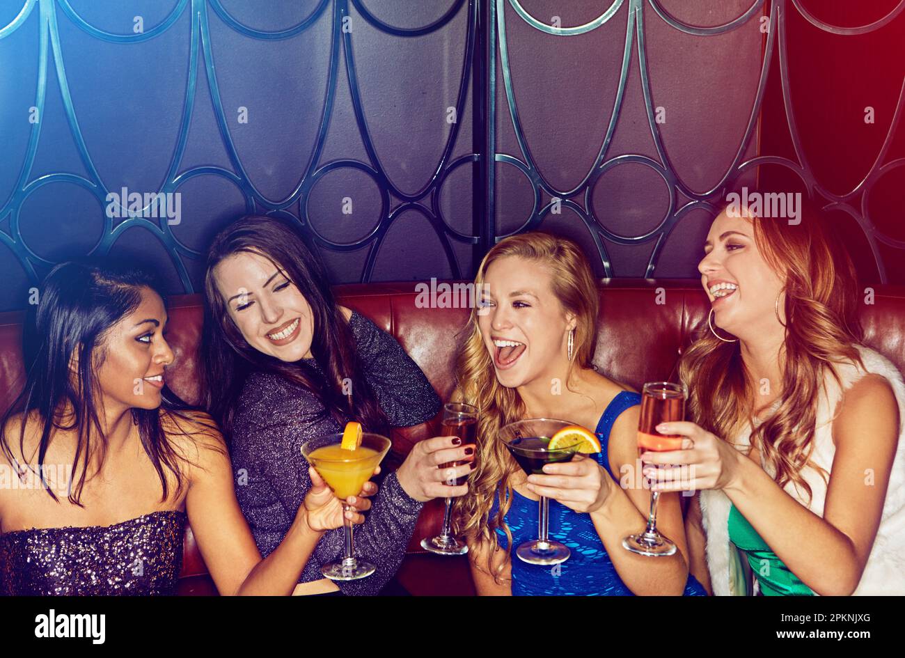 Ladies night is in full swing. a group of friends having drinks at a ...