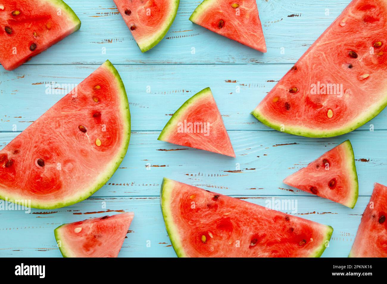 Slices watermelon on the blue color wooden background. Watermelon is ...