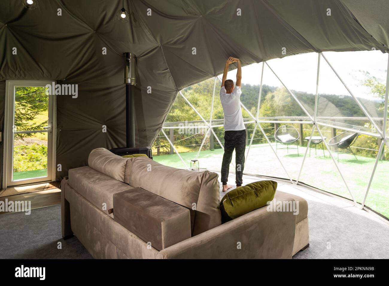 young man resting outside the city in glamping Stock Photo - Alamy
