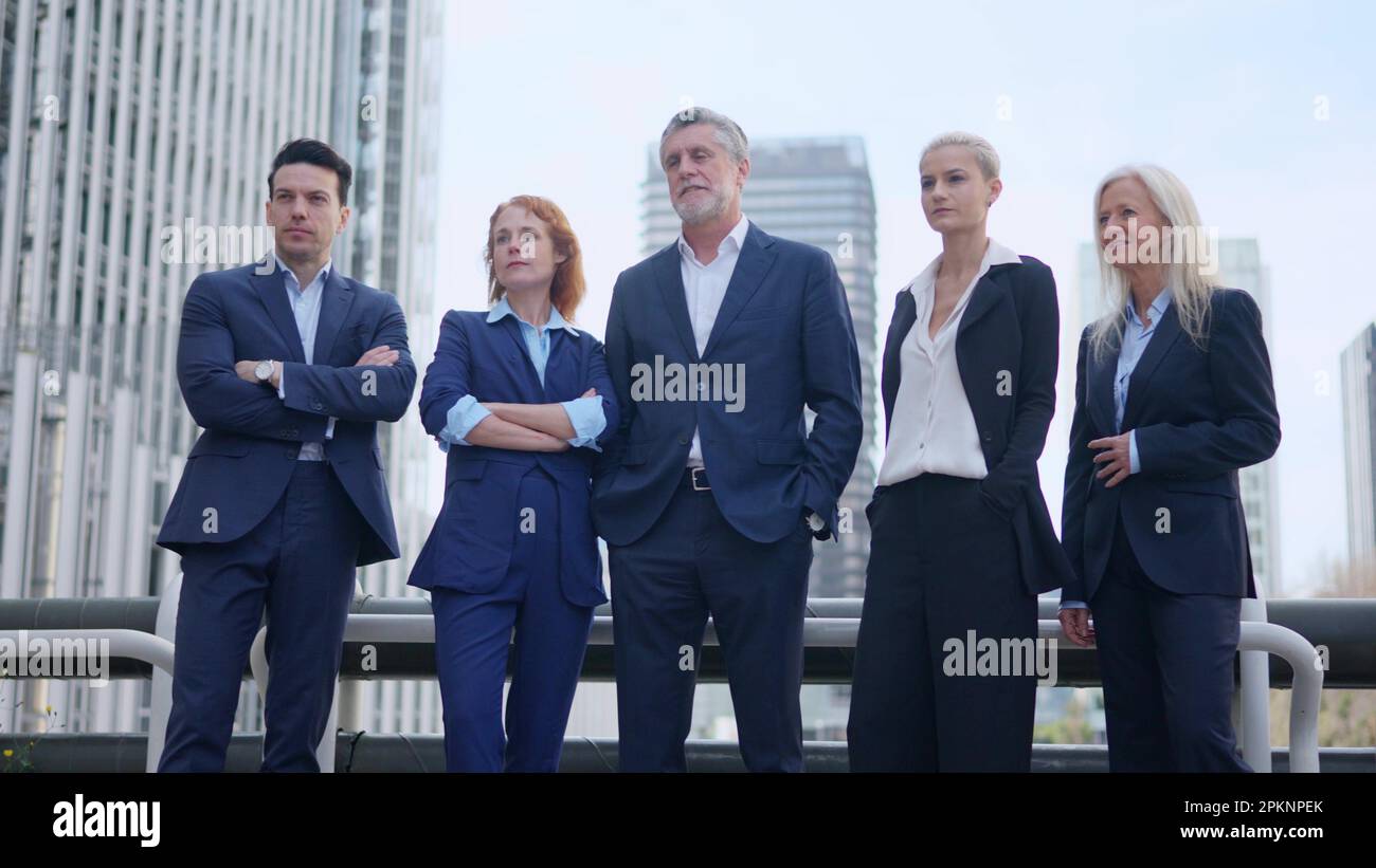 Group pf business people standing and smiling outdoors Stock Photo - Alamy