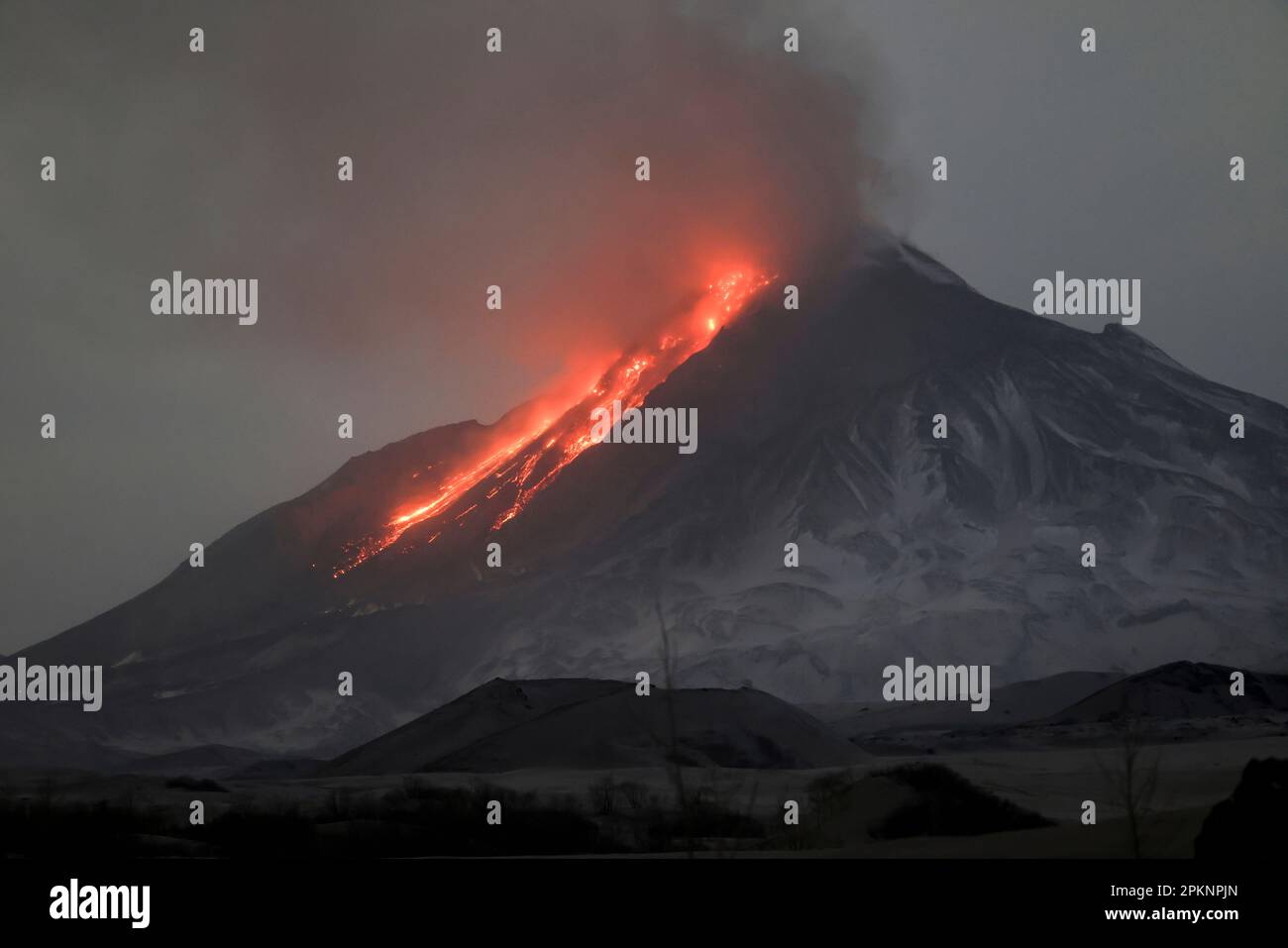 Lava and steams are visible during the the Bezymianny volcano's ...