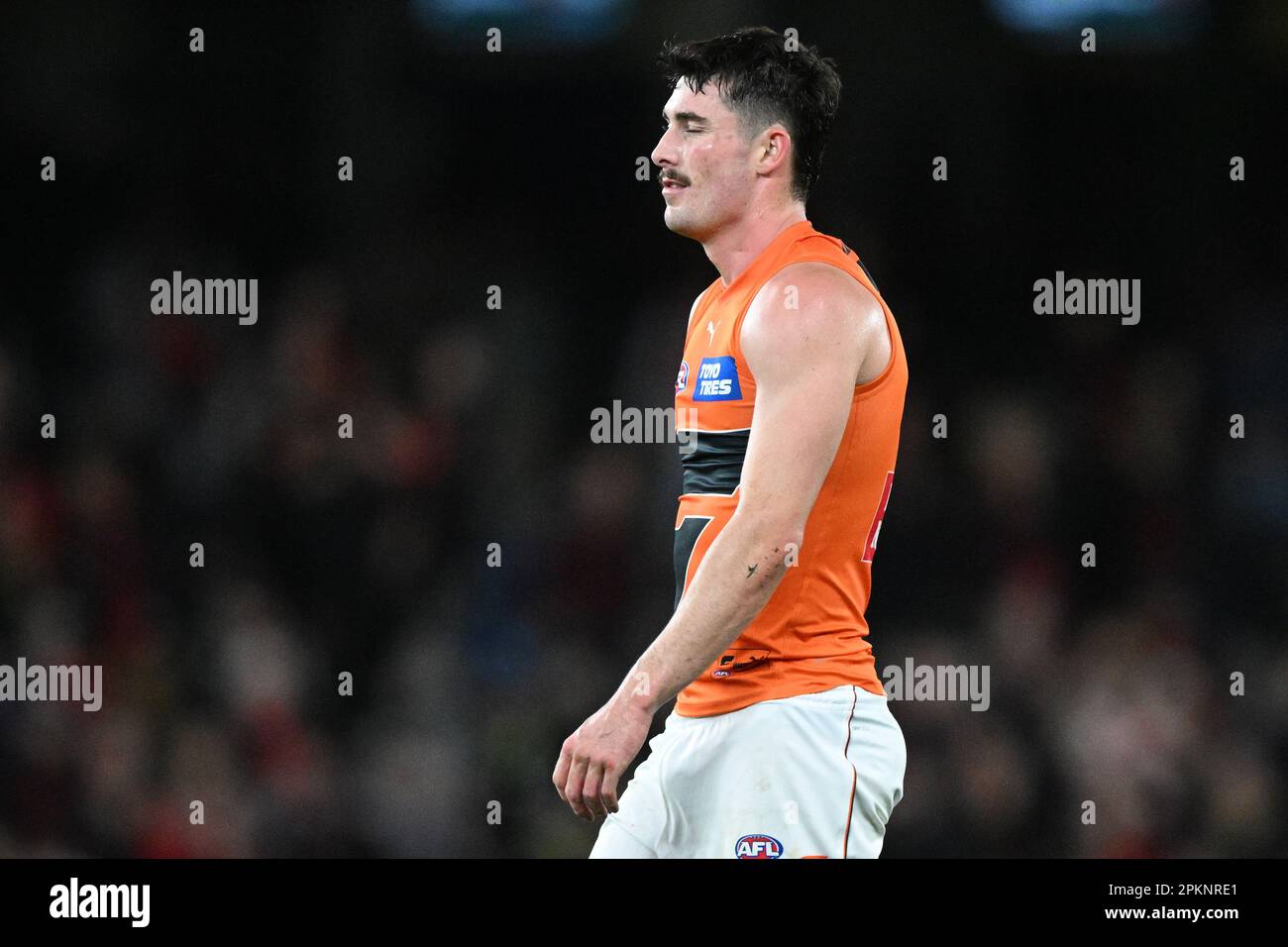 Lachie Ash of the Giants looks on after being defeated by Essendon in ...