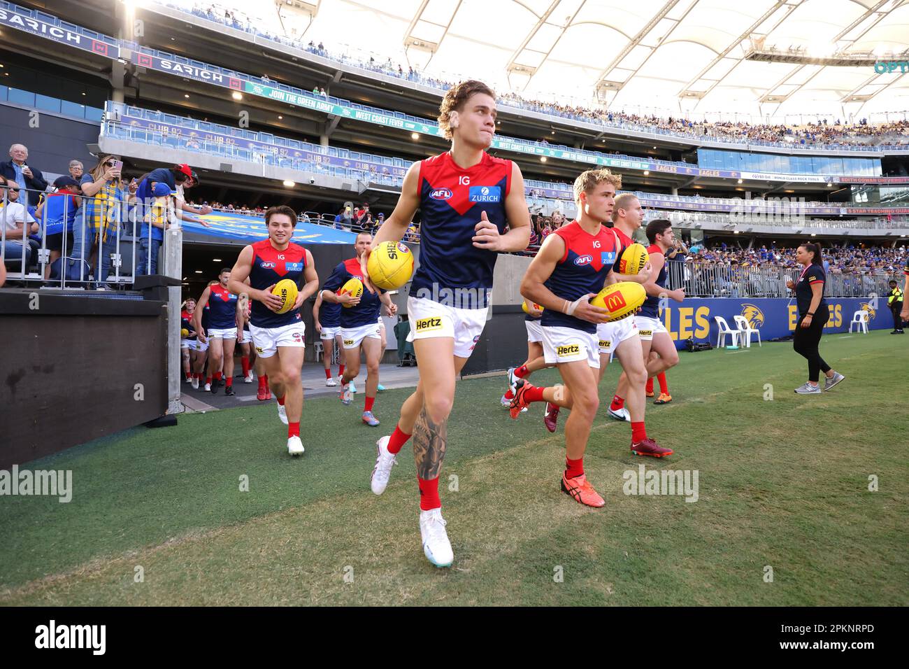The Demons enter the field before the start of play during the AFL ...