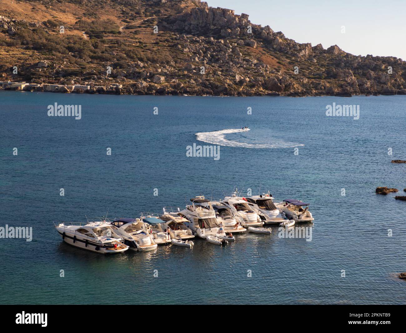 Mgarr, Malta - May 2021: Top view of Qarraba Bay with motorboats in the ...