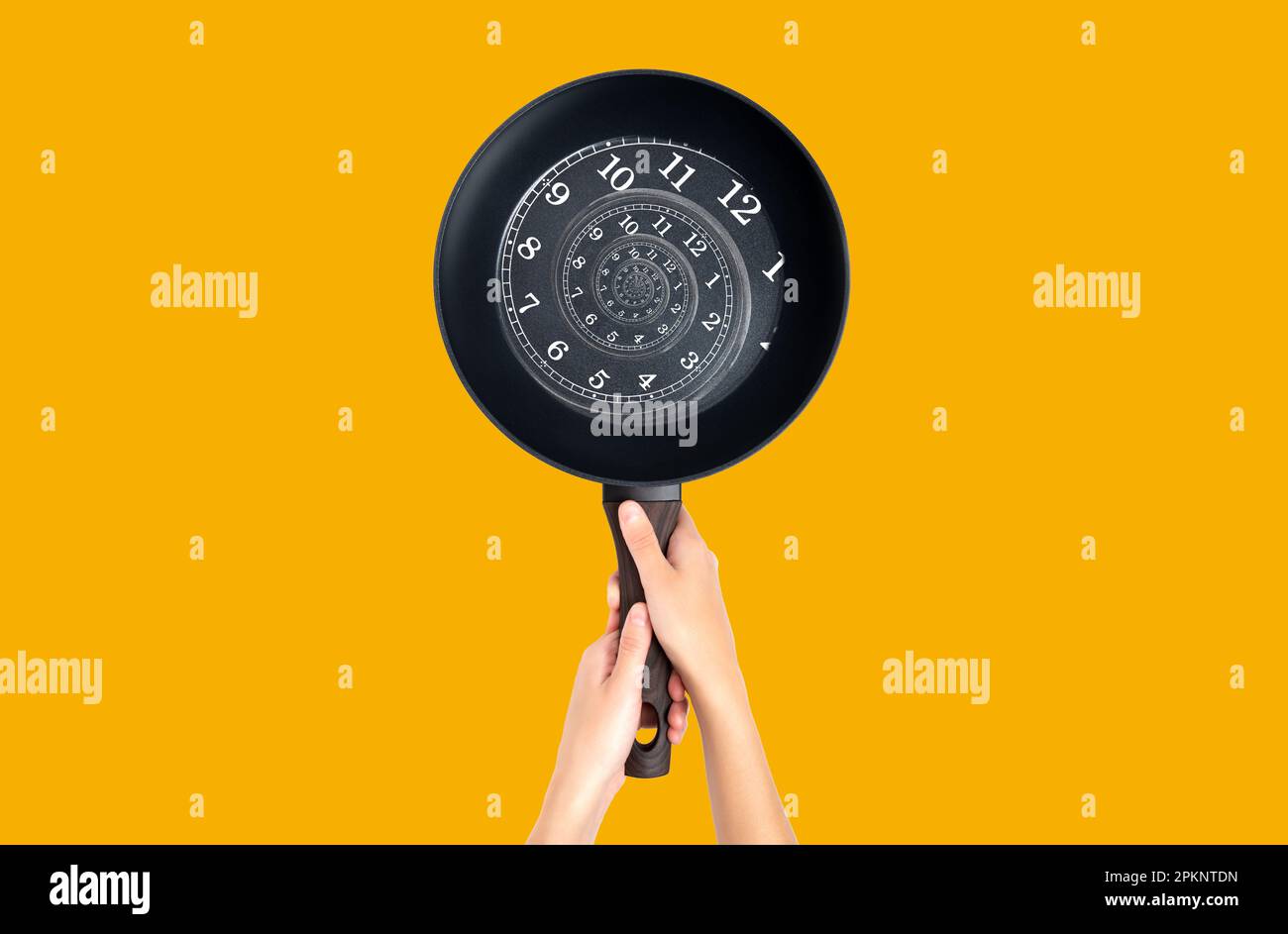 Frying pan with a unique watch funnel on its cooking surface ...