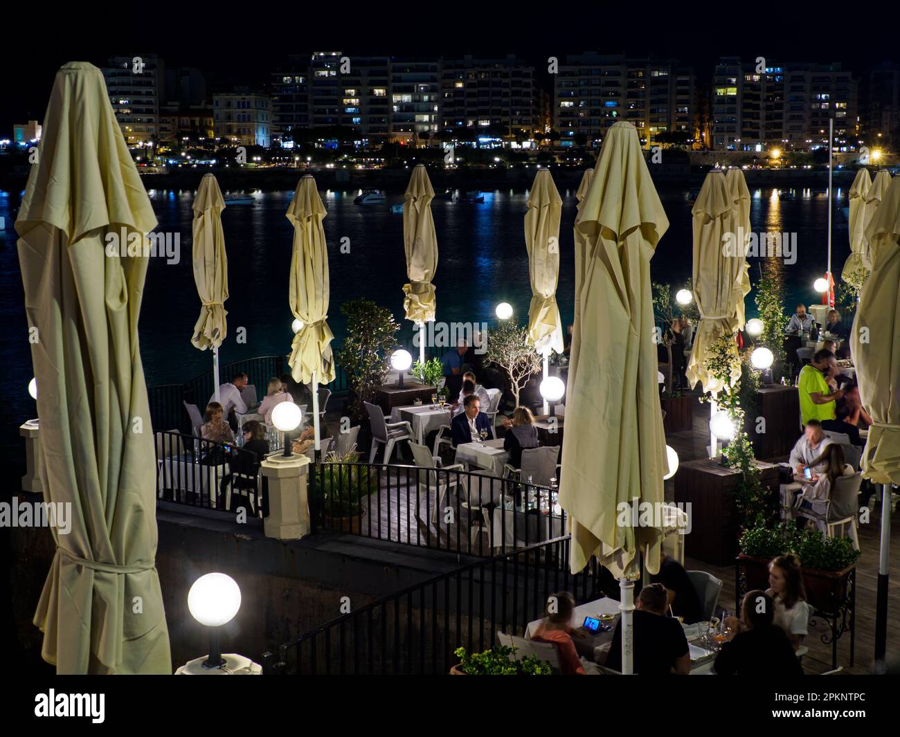St Julian, Sliema, Malta - May, 2021: Restaurant with plenty of people ...