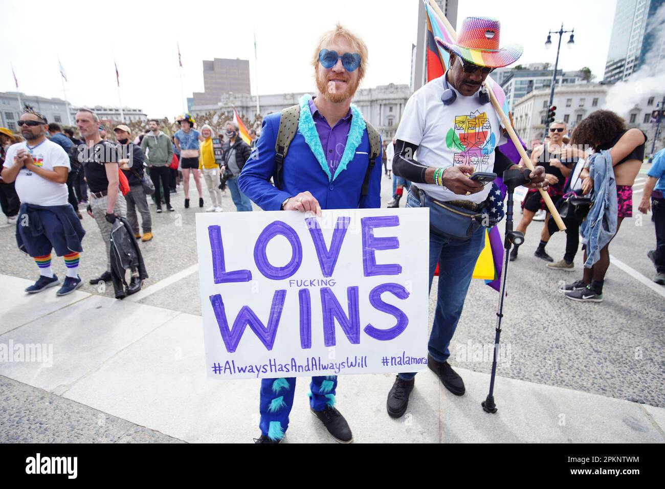 (EDITOR'S NOTE: Image depicts profanity) A protester holds a placard ...