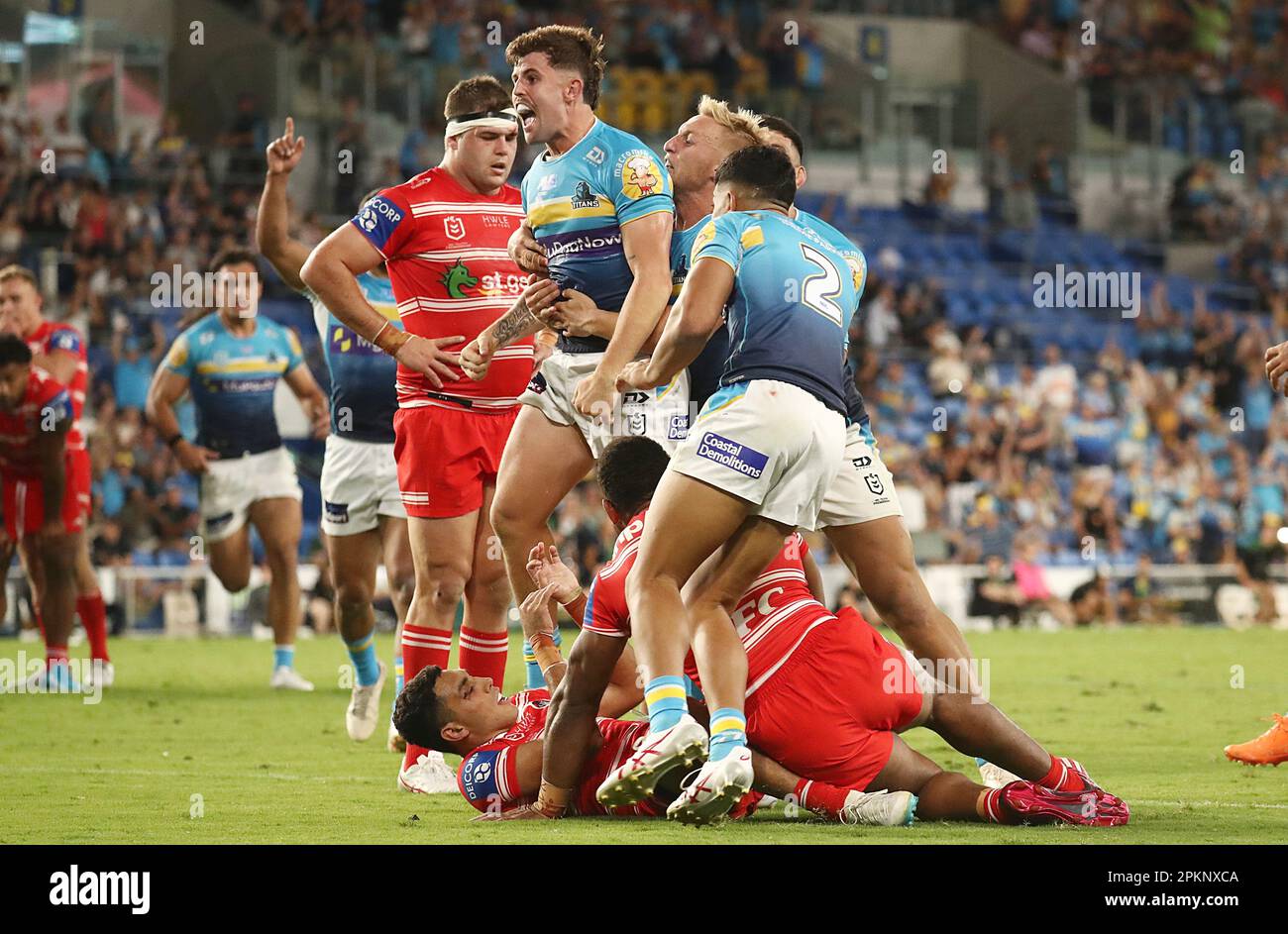 Toby Sexton of the Titans celebrates scoring a try during the NRL Round ...