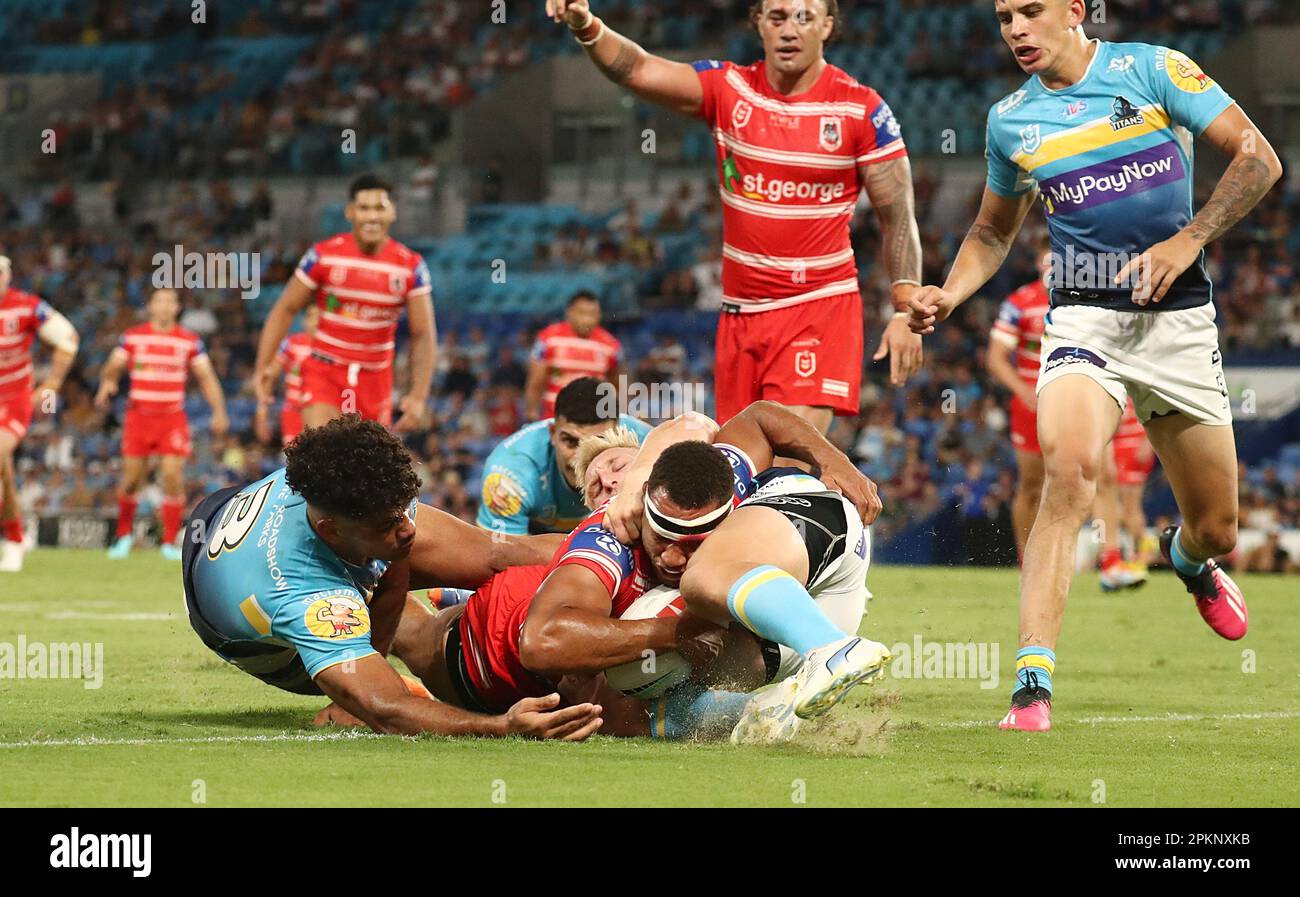 Moses Mbye of the Dragons is held up over the line by Tanah Boyd of the ...