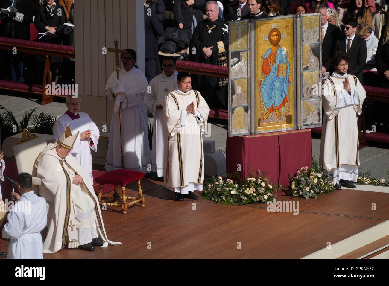 The deacons stand by the icon of the holy savior, right, during the ...