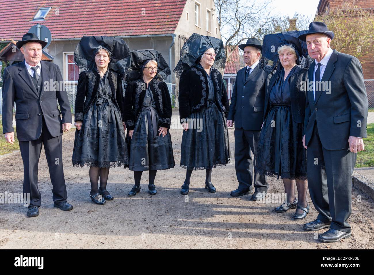 09 April 2023, Brandenburg, Burg (Spreewald): Women in black ...