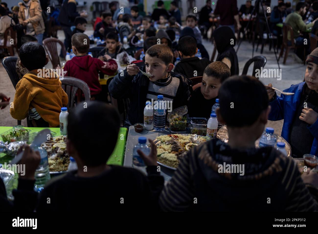 08 April 2023, Syria, Idlib: A view of a mass iftar for orphaned ...