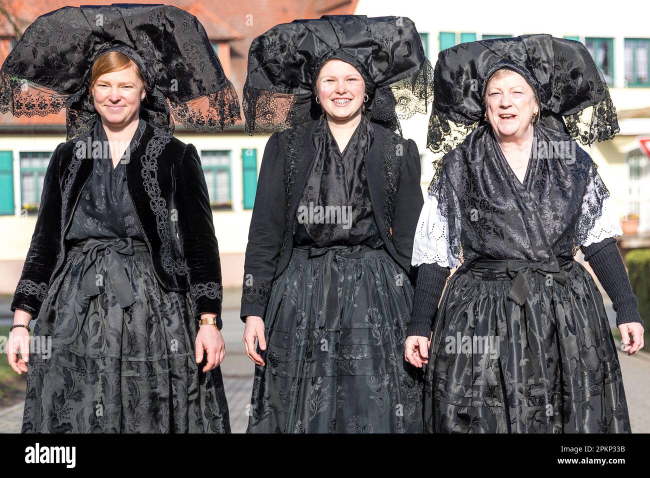 09 April 2023, Brandenburg, Burg (Spreewald): Women in black ...