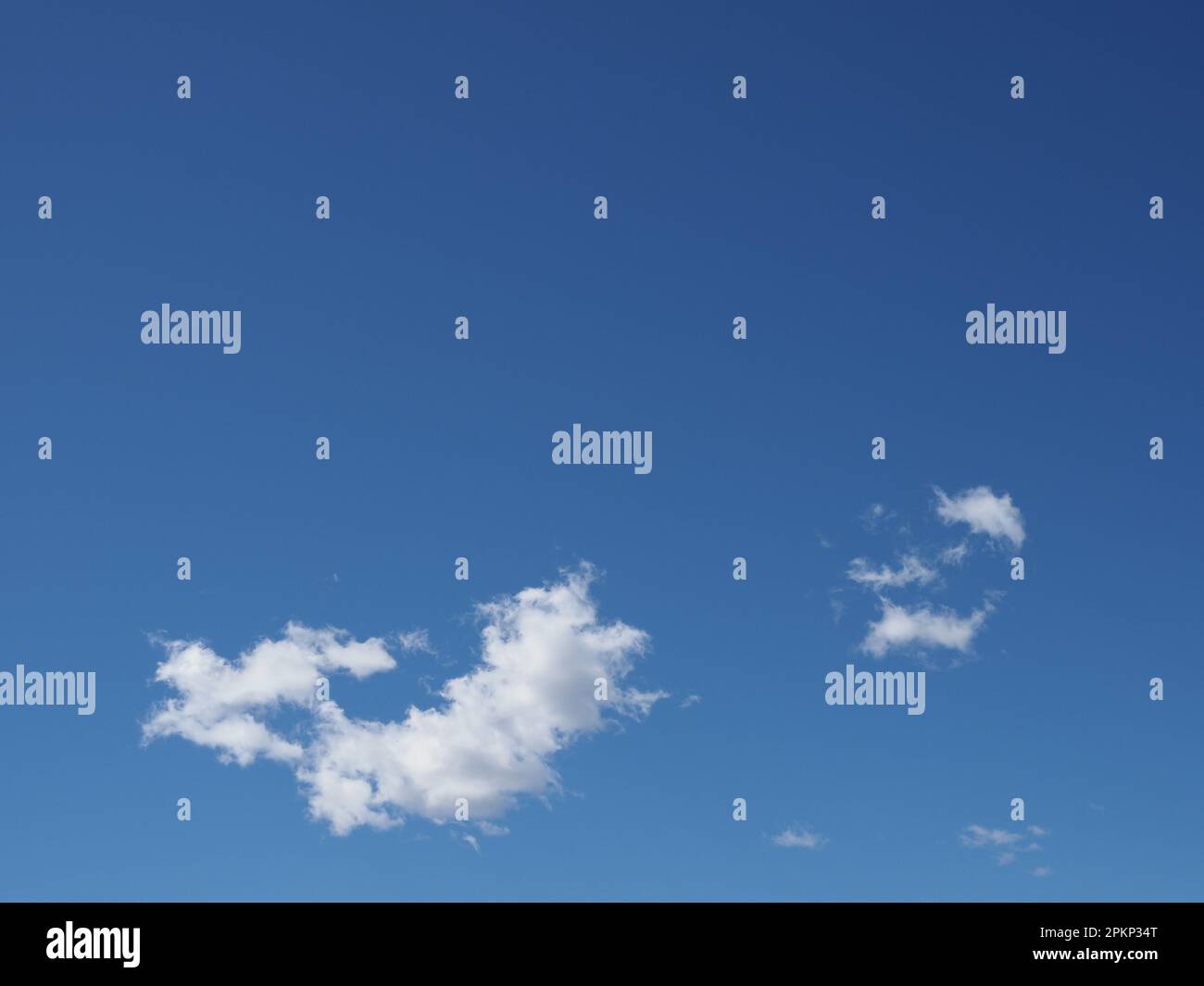 blue sky with lonely clouds useful as a background Stock Photo - Alamy