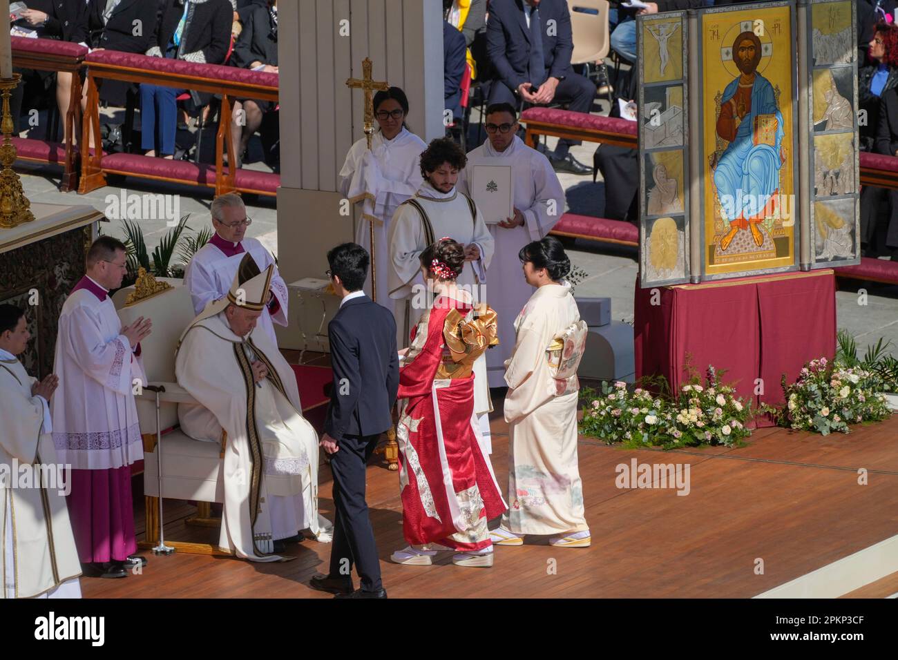 Gift bearers, some in traditional Japanese kimono dress, bring their ...