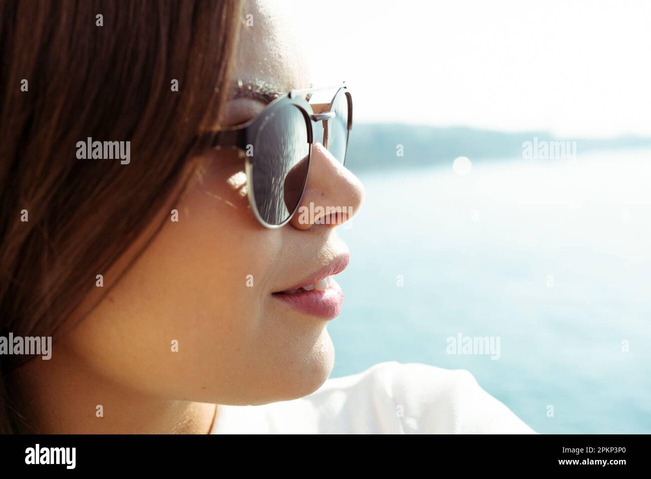 Close headshot of pretty female woman middle east face with sunglasses ...