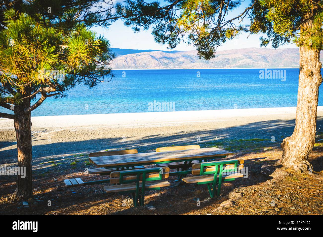 Tranquil view of blue Salda lake in the background and tables ...
